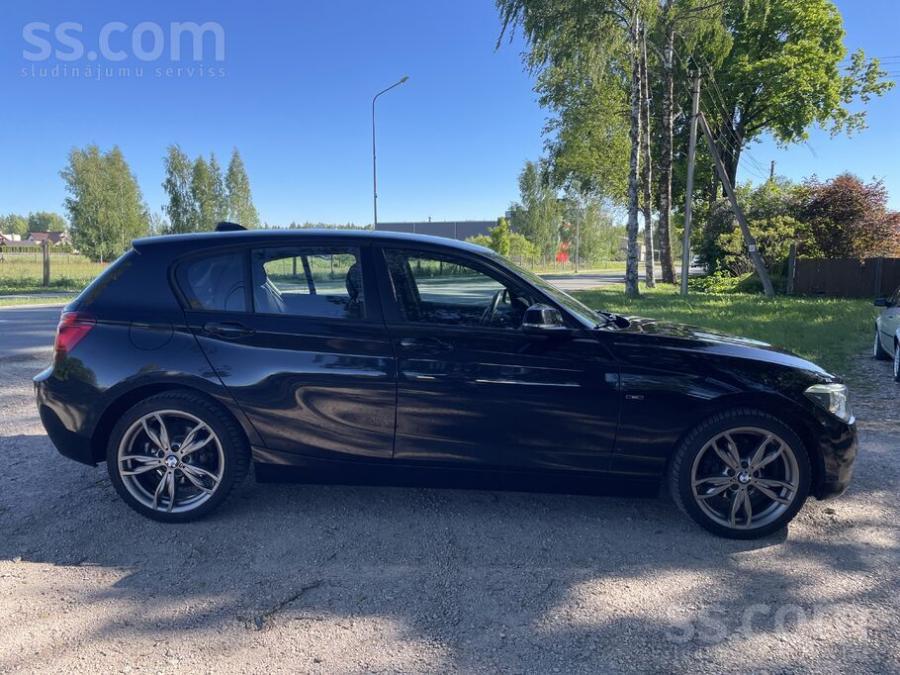 Black BMW 118 2014 in Riga, with an engine capacity of 2.00 L and mileage of 180 thousand km for 7990 €, photo 7 on AUTOMOTO.COM.LV