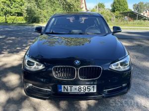 Black BMW 118 2014 in Riga, with an engine capacity of 2.00 L and mileage of 180 thousand km for 7990 €, photo 9 on AUTOMOTO.COM.LV