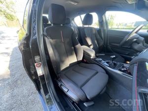 Black BMW 118 2014 in Riga, with an engine capacity of 2.00 L and mileage of 180 thousand km for 7990 €, photo 18 on AUTOMOTO.COM.LV