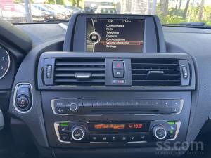 Black BMW 118 2014 in Riga, with an engine capacity of 2.00 L and mileage of 180 thousand km for 7990 €, photo 24 on AUTOMOTO.COM.LV