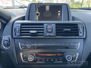 Black BMW 118 2014 in Riga, with an engine capacity of 2.00 L and mileage of 180 thousand km for 7990 €, photo 26 on AUTOMOTO.COM.LV