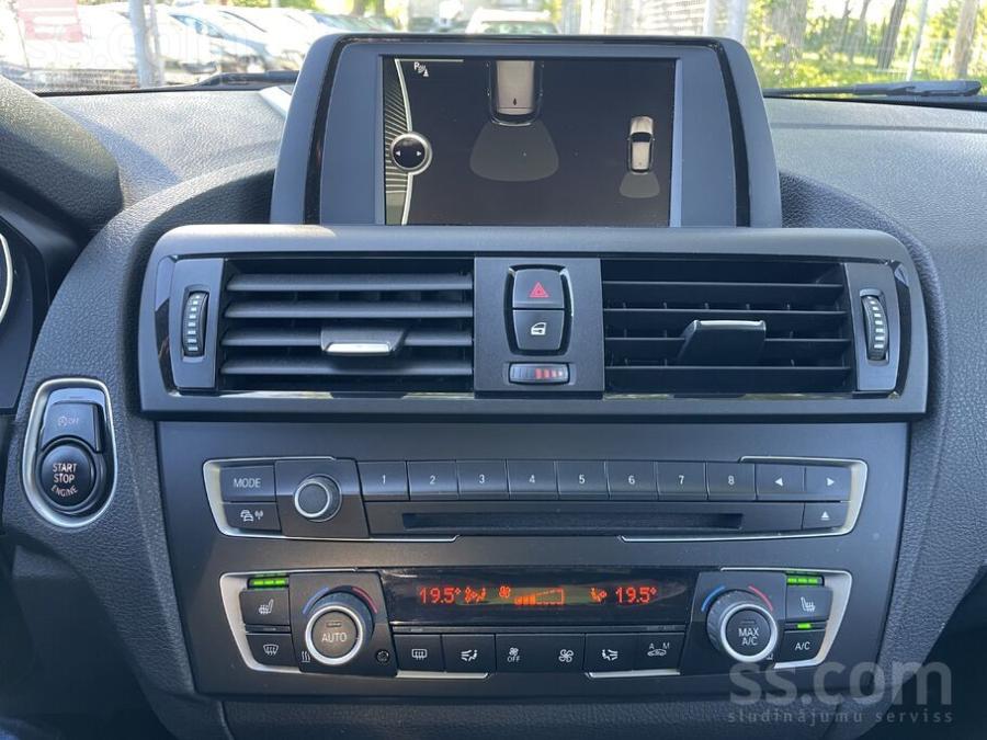 Black BMW 118 2014 in Riga, with an engine capacity of 2.00 L and mileage of 180 thousand km for 7990 €, photo 26 on AUTOMOTO.COM.LV
