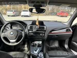 Black BMW 118 2017 in Riga, with an engine capacity of 2.00 L and mileage of 219 thousand km for 11700 €, photo 9 on AUTOMOTO.COM.LV