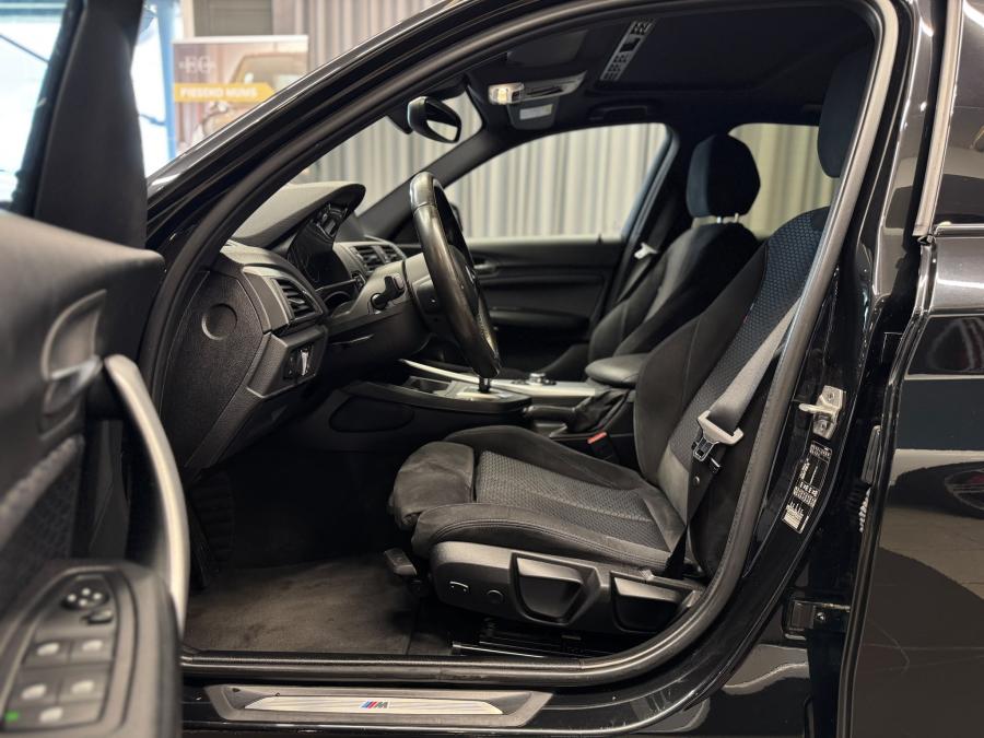 Black BMW 118 2017 in Riga, with an engine capacity of 2.00 L and mileage of 229 thousand km for 12990 €, photo 8 on AUTOMOTO.COM.LV