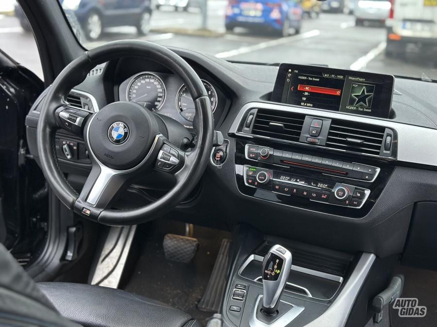 Black BMW 118 2018 in Vilnius, with an engine capacity of 1.50 L and mileage of 100 thousand km for 16500 €, photo 6 on AUTOMOTO.COM.LV