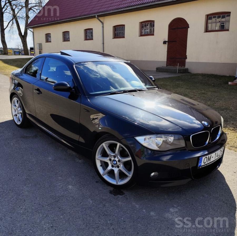 Black BMW 120 2009 in Ogre, with an engine capacity of 2.00 L and mileage of 196 thousand km for 5995 €, photo 1 on AUTOMOTO.COM.LV