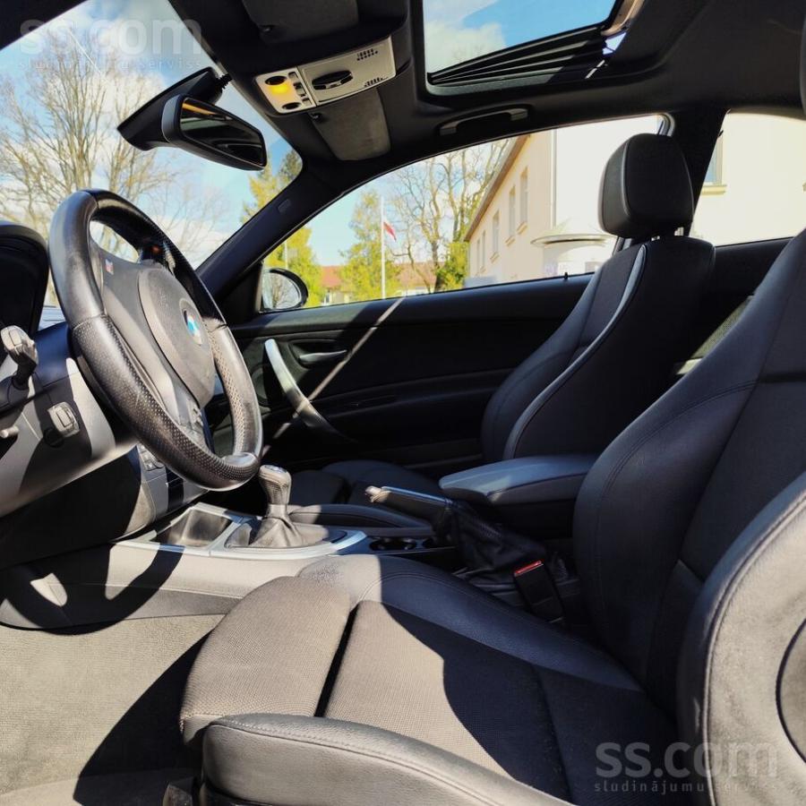 Black BMW 120 2009 in Ogre, with an engine capacity of 2.00 L and mileage of 196 thousand km for 5995 €, photo 6 on AUTOMOTO.COM.LV