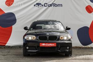Black BMW 120 2013 in Riga, with an engine capacity of 2.00 L and mileage of 285 thousand km for 8790 €, photo 3 on AUTOMOTO.COM.LV