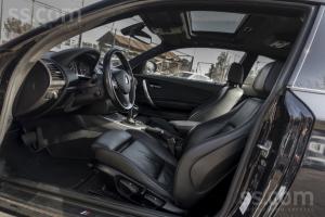 Black BMW 120 2013 in Riga, with an engine capacity of 2.00 L and mileage of 285 thousand km for 8790 €, photo 8 on AUTOMOTO.COM.LV