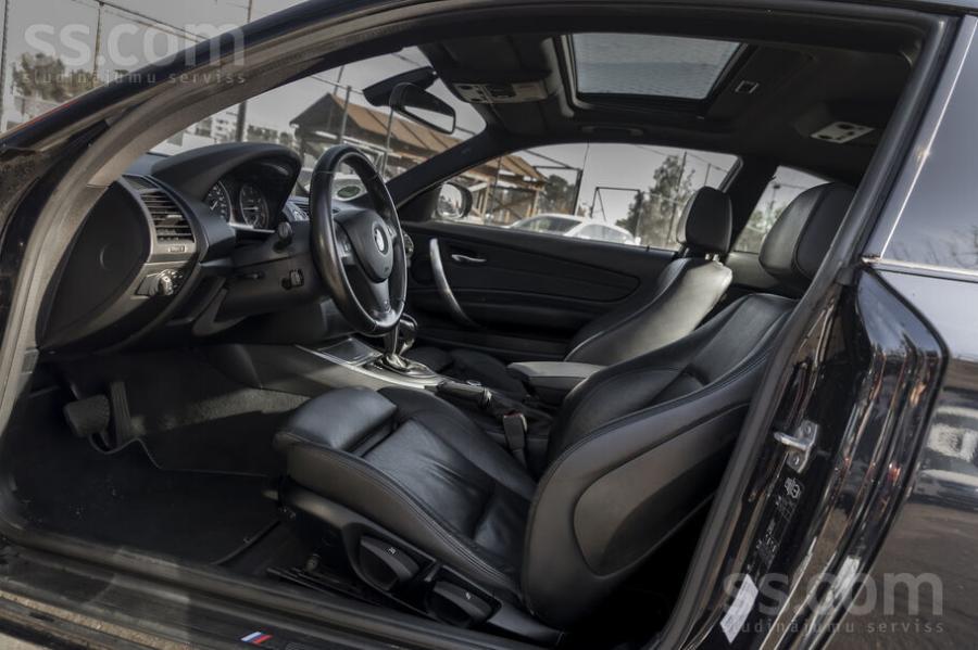 Black BMW 120 2013 in Riga, with an engine capacity of 2.00 L and mileage of 285 thousand km for 8790 €, photo 8 on AUTOMOTO.COM.LV