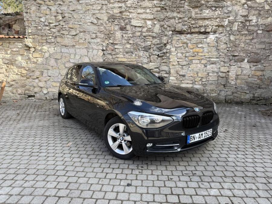 Black BMW 120 2012 in Cesis, with an engine capacity of 2.00 L and mileage of 273 thousand km for 6950 €, photo 1 on AUTOMOTO.COM.LV