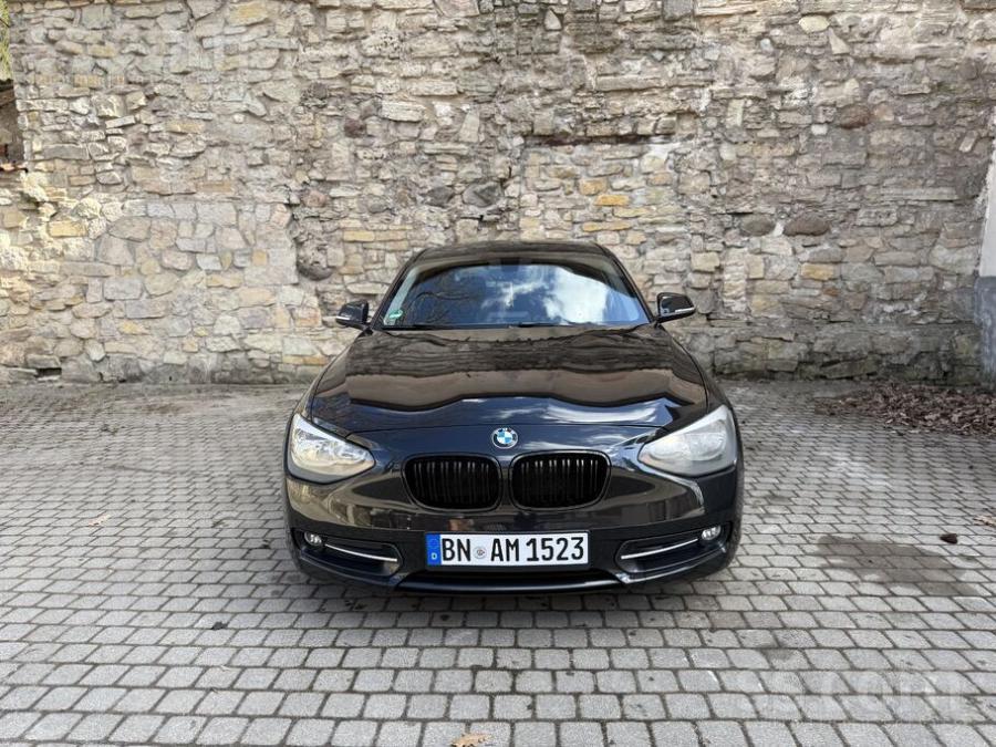 Black BMW 120 2012 in Cesis, with an engine capacity of 2.00 L and mileage of 273 thousand km for 6950 €, photo 3 on AUTOMOTO.COM.LV