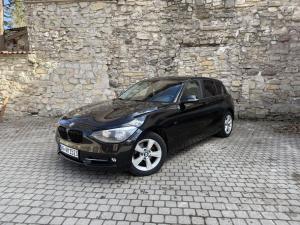 Black BMW 120 2012 in Cesis, with an engine capacity of 2.00 L and mileage of 273 thousand km for 6950 €, photo 4 on AUTOMOTO.COM.LV