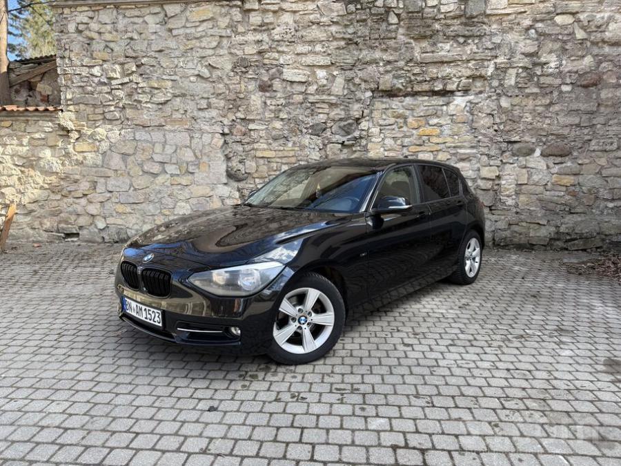Black BMW 120 2012 in Cesis, with an engine capacity of 2.00 L and mileage of 273 thousand km for 6950 €, photo 4 on AUTOMOTO.COM.LV