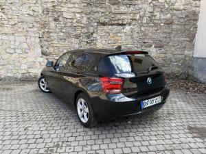 Black BMW 120 2012 in Cesis, with an engine capacity of 2.00 L and mileage of 273 thousand km for 6950 €, photo 5 on AUTOMOTO.COM.LV