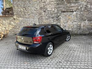 Black BMW 120 2012 in Cesis, with an engine capacity of 2.00 L and mileage of 273 thousand km for 6950 €, photo 7 on AUTOMOTO.COM.LV