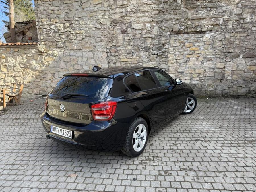 Black BMW 120 2012 in Cesis, with an engine capacity of 2.00 L and mileage of 273 thousand km for 6950 €, photo 7 on AUTOMOTO.COM.LV