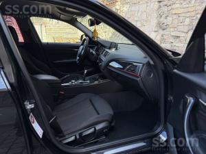 Black BMW 120 2012 in Cesis, with an engine capacity of 2.00 L and mileage of 273 thousand km for 6950 €, photo 10 on AUTOMOTO.COM.LV