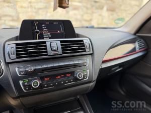 Black BMW 120 2012 in Cesis, with an engine capacity of 2.00 L and mileage of 273 thousand km for 6950 €, photo 13 on AUTOMOTO.COM.LV