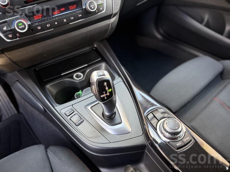 Black BMW 120 2012 in Cesis, with an engine capacity of 2.00 L and mileage of 273 thousand km for 6950 €, photo 14 on AUTOMOTO.COM.LV