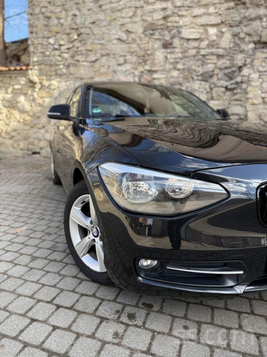 Black BMW 120 2012 in Cesis, with an engine capacity of 2.00 L and mileage of 273 thousand km for 6950 €, photo 22 on AUTOMOTO.COM.LV