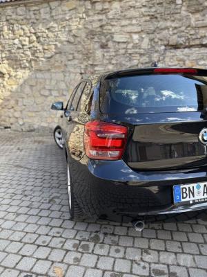 Black BMW 120 2012 in Cesis, with an engine capacity of 2.00 L and mileage of 273 thousand km for 6950 €, photo 23 on AUTOMOTO.COM.LV