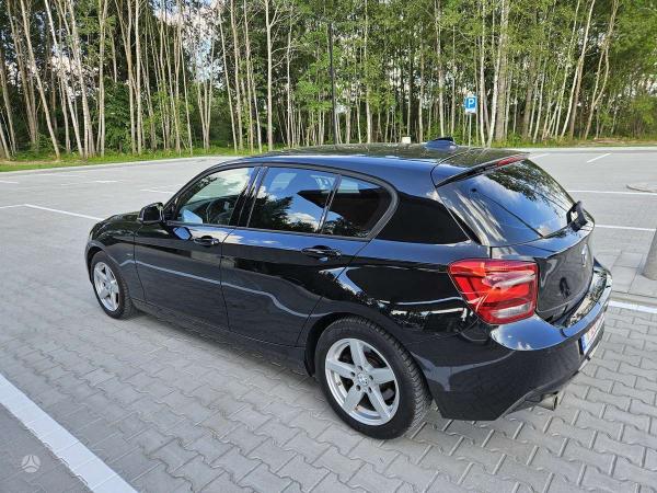 Black BMW 120 2012 in Raseiniai, with an engine capacity of 2.00 L and mileage of 311 thousand km for 7599 €, photo 1 on AUTOMOTO.COM.LV