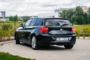 Black BMW 120 2012 in Riga, with an engine capacity of 2.00 L and mileage of 268 thousand km for 6690 €, photo 9 on AUTOMOTO.COM.LV