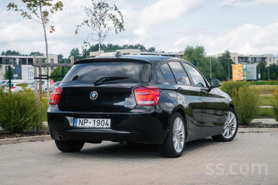 Black BMW 120 2012 in Riga, with an engine capacity of 2.00 L and mileage of 268 thousand km for 6690 €, photo 10 on AUTOMOTO.COM.LV