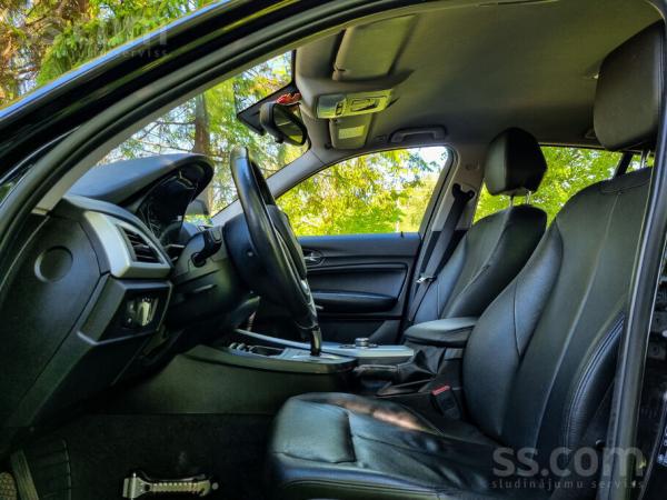 Black BMW 120 2013 in Riga, with an engine capacity of 2.00 L and mileage of 238 thousand km for 6350 €, photo 5 on AUTOMOTO.COM.LV