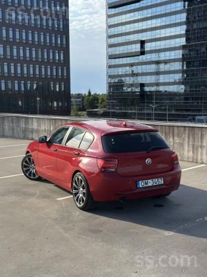 Red BMW 120 2011 in Riga, with an engine capacity of 2.00 L and mileage of 254 thousand km for 8490 €, photo 4 on AUTOMOTO.COM.LV