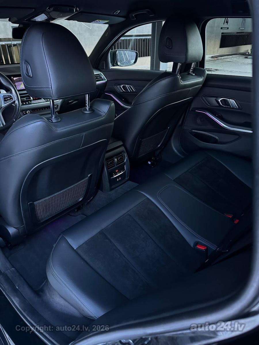 Black BMW 3 Series 2021 in Riga, with an engine capacity of 2.00 L and mileage of 126 thousand km for 25000 €, photo 18 on AUTOMOTO.COM.LV