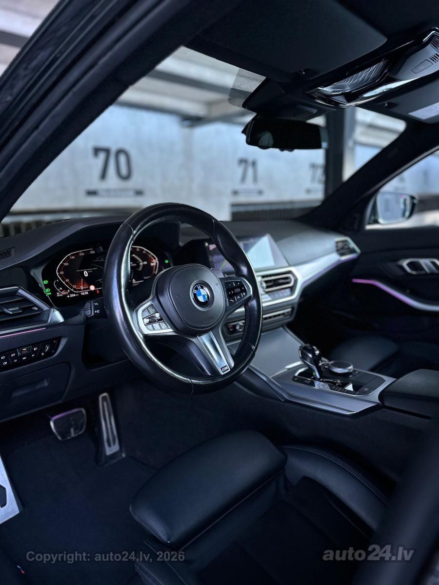 Black BMW 3 Series 2021 in Riga, with an engine capacity of 2.00 L and mileage of 126 thousand km for 25000 €, photo 20 on AUTOMOTO.COM.LV