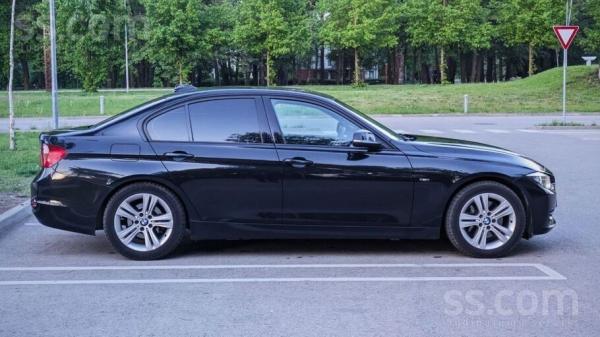 Black BMW 318 2012 in Riga, with an engine capacity of 1.80 L and mileage of 329 thousand km for 7400 €, photo 2 on AUTOMOTO.COM.LV