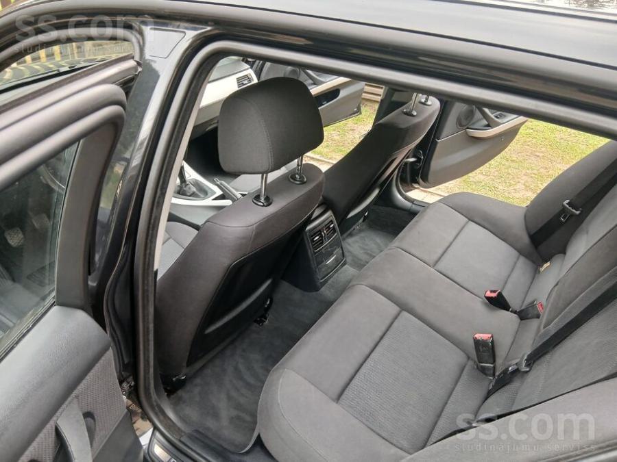 Black BMW 318 2009 in Ogre, with an engine capacity of 2.00 L and mileage of 310 thousand km for 3490 €, photo 9 on AUTOMOTO.COM.LV