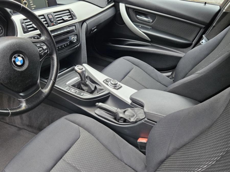 Black BMW 318 2012 in Riga, with an engine capacity of 2.00 L and mileage of 265 thousand km for 7490 €, photo 14 on AUTOMOTO.COM.LV