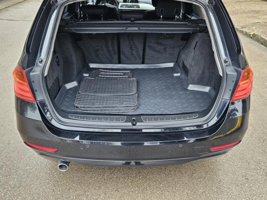 Black BMW 318 2012 in Riga, with an engine capacity of 2.00 L and mileage of 265 thousand km for 7490 €, photo 18 on AUTOMOTO.COM.LV