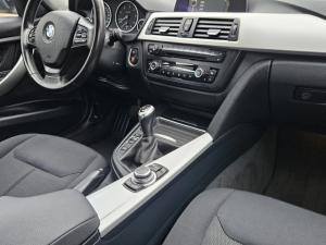 Black BMW 318 2012 in Riga, with an engine capacity of 2.00 L and mileage of 265 thousand km for 7490 €, photo 21 on AUTOMOTO.COM.LV