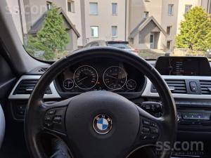 Black BMW 318 2013 in Riga, with an engine capacity of 2.00 L and mileage of 313 thousand km for 7200 €, photo 10 on AUTOMOTO.COM.LV