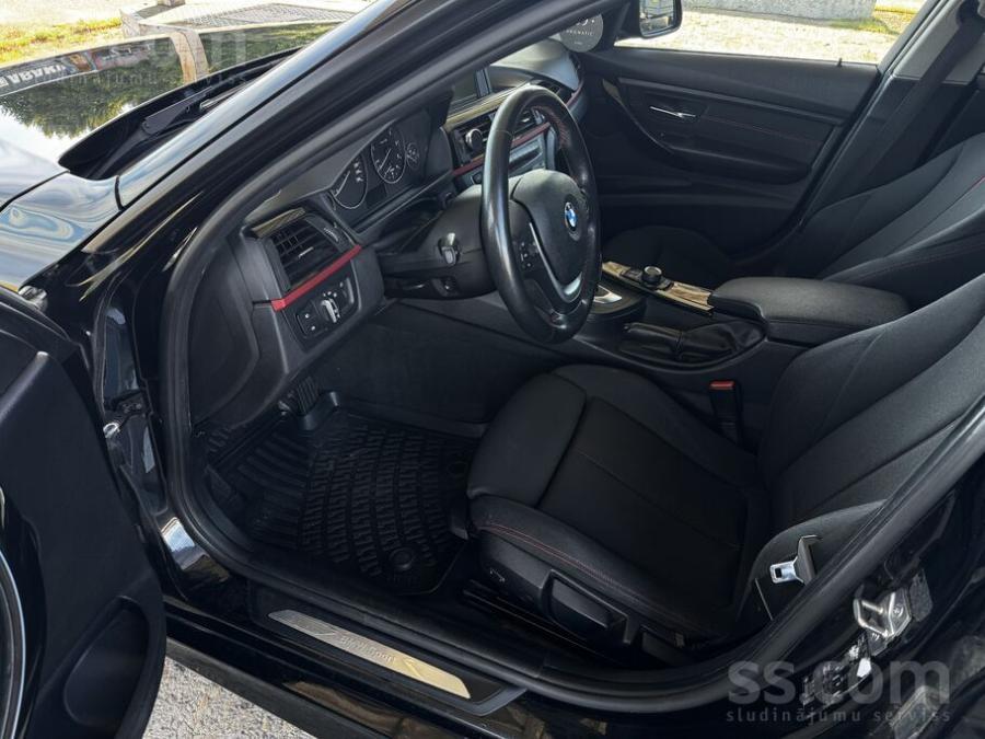 Black BMW 318 2013 in Liepaja, with an engine capacity of 2.00 L and mileage of 302 thousand km for 8490 €, photo 6 on AUTOMOTO.COM.LV