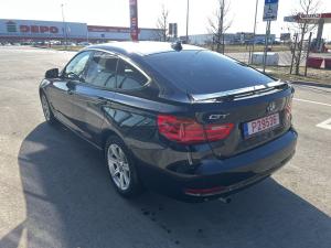 Black BMW 318 Gran Turismo 2013 in Panevezys, with an engine capacity of 2.00 L and mileage of 317 thousand km for 6499 €, photo 2 on AUTOMOTO.COM.LV