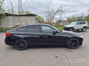 Black BMW 320 2013 in Riga, with an engine capacity of 2.00 L and mileage of 306 thousand km for 9490 €, photo 6 on AUTOMOTO.COM.LV