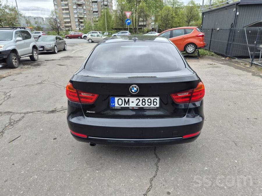 Black BMW 320 2013 in Riga, with an engine capacity of 2.00 L and mileage of 306 thousand km for 9490 €, photo 8 on AUTOMOTO.COM.LV