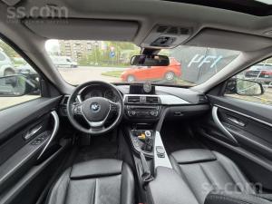 Black BMW 320 2013 in Riga, with an engine capacity of 2.00 L and mileage of 306 thousand km for 9490 €, photo 12 on AUTOMOTO.COM.LV