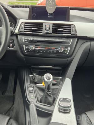 Black BMW 320 2013 in Riga, with an engine capacity of 2.00 L and mileage of 306 thousand km for 9490 €, photo 13 on AUTOMOTO.COM.LV