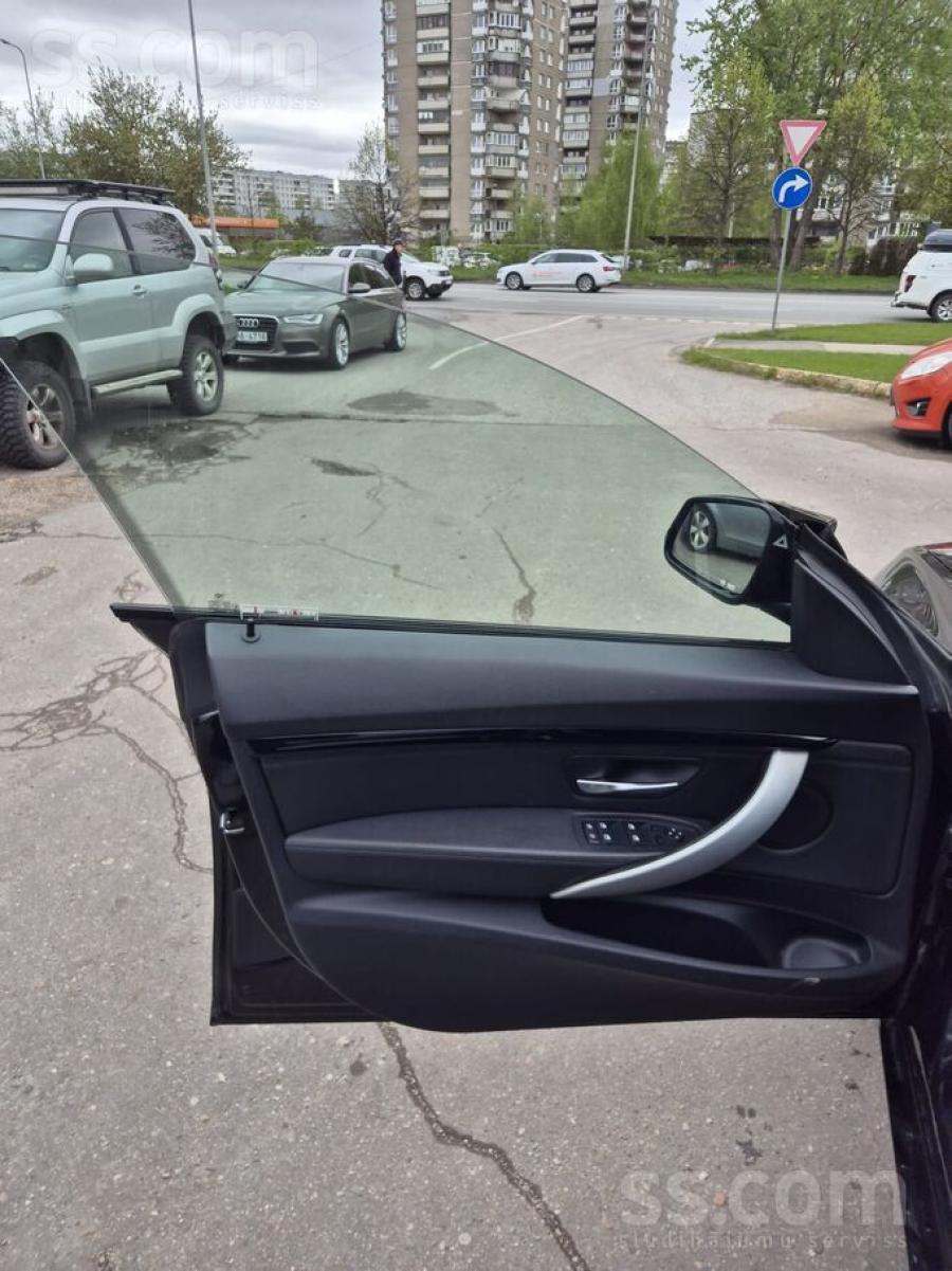 Black BMW 320 2013 in Riga, with an engine capacity of 2.00 L and mileage of 306 thousand km for 9490 €, photo 14 on AUTOMOTO.COM.LV