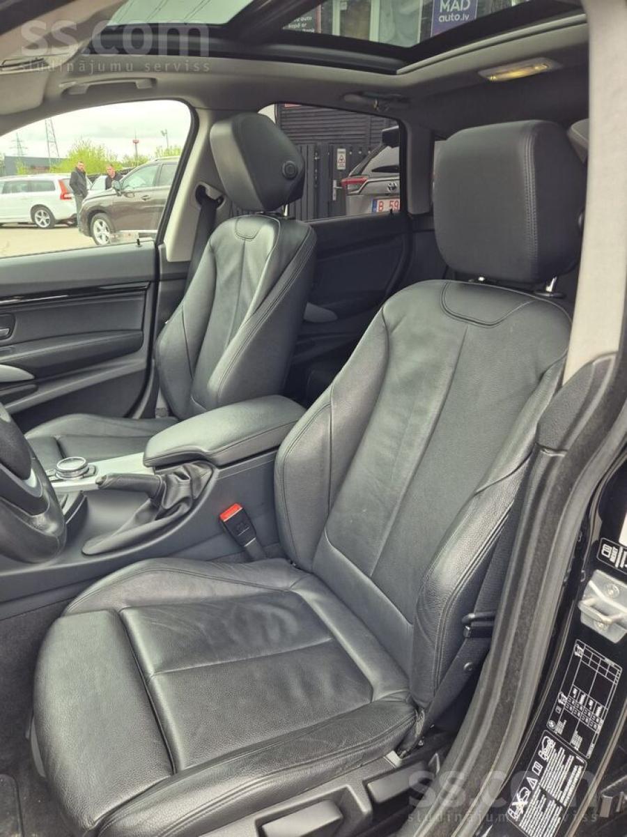 Black BMW 320 2013 in Riga, with an engine capacity of 2.00 L and mileage of 306 thousand km for 9490 €, photo 18 on AUTOMOTO.COM.LV