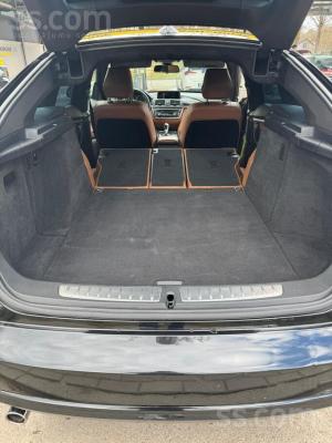 Black BMW 320 2013 in Jelgava, with an engine capacity of 2.00 L and mileage of 305 thousand km for 10800 €, photo 14 on AUTOMOTO.COM.LV