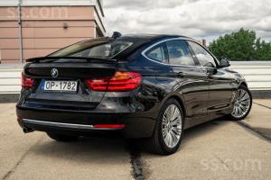 Black BMW 320 2013 in Riga, with an engine capacity of 2.00 L and mileage of 235 thousand km for 11990 €, photo 6 on AUTOMOTO.COM.LV