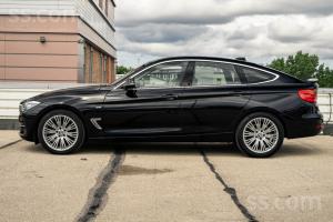 Black BMW 320 2013 in Riga, with an engine capacity of 2.00 L and mileage of 235 thousand km for 11990 €, photo 12 on AUTOMOTO.COM.LV